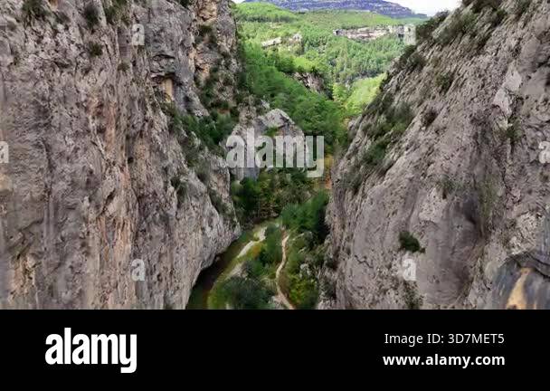 Breathtaking aerial view soaring through a narrow ravine, unveiling a ...