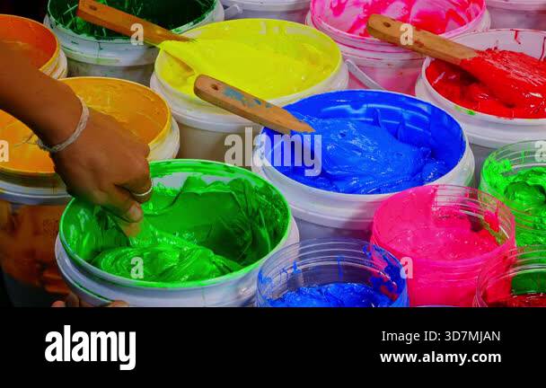 stirring green plastisol ink in white bucket Stock Video Footage - Alamy