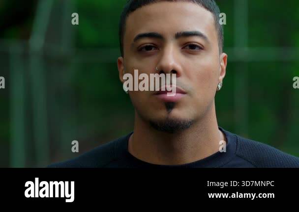 Confident young Latin Hispanic man of African descent with nose ring ...