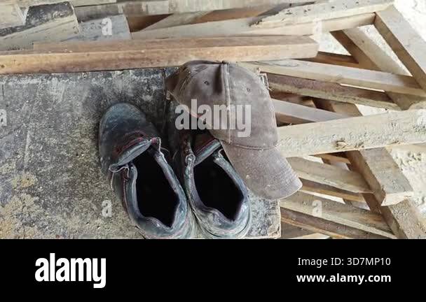 Scene of worn out safety boot,rubber shoe,and smelly stockings left at ...