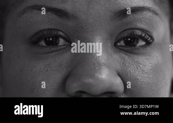 Close-up of young African American womans eyes showing thoughtful and ...