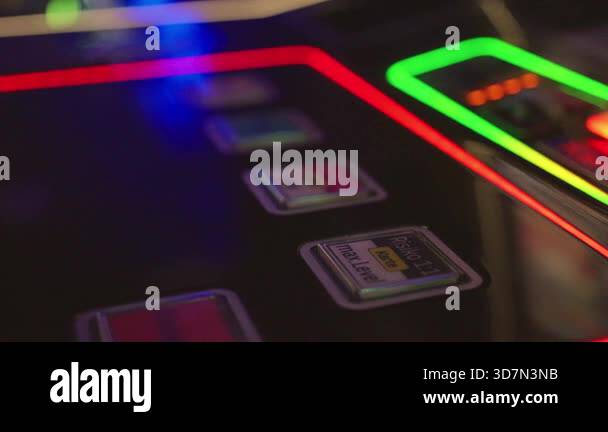 close-up colorful slot machine panel with glowing red and green led ...
