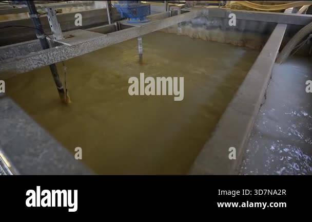 Industrial scene of synthetic gypsum production, highlighting water ...