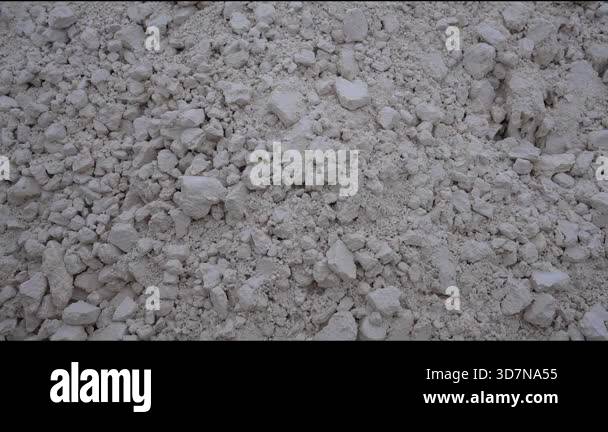 Close-up of synthetic gypsum pile, highlighting texture and material ...
