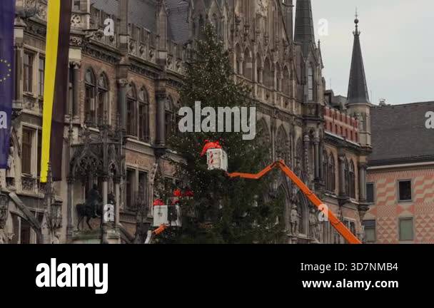 10 November 2025. Munich, Germany. Workers use boom lifts to decorate a ...