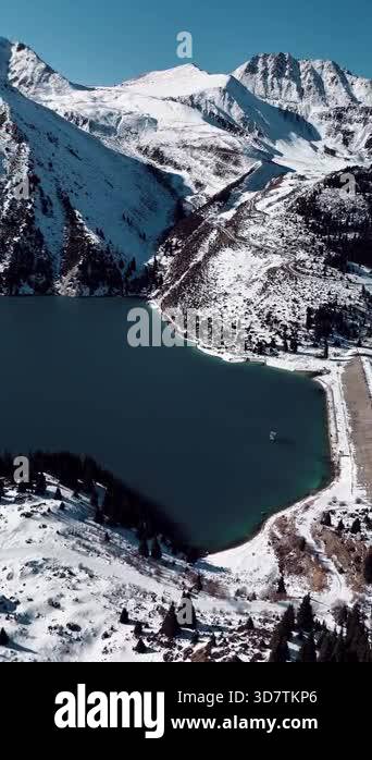 Vertical video Aerial drone view of Big Almaty mountains lake landscape ...