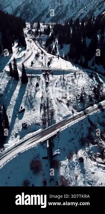 Vertical video Aerial drone view of Big Almaty mountains lake landscape ...