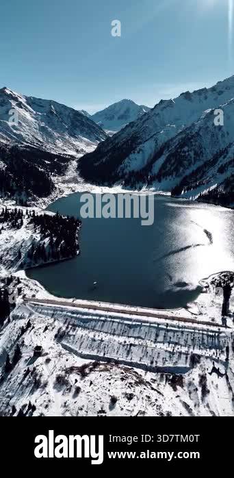 Vertical video Aerial drone view of Big Almaty mountains lake landscape ...