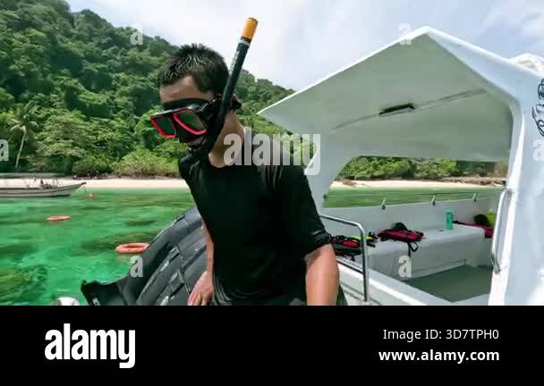 Self-portrait of boy jumping into open water in Pulau Kapas Stock Video ...