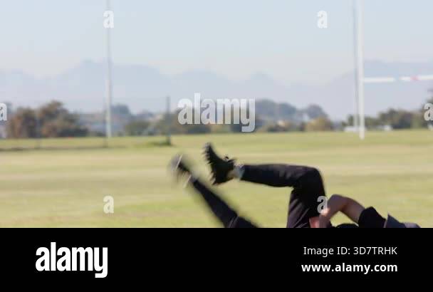 After ball flying, White male player springing, diving to secure ball ...