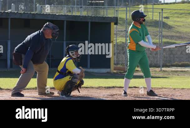 Umpire signaling strike three batter dropping bat racing to first at ...