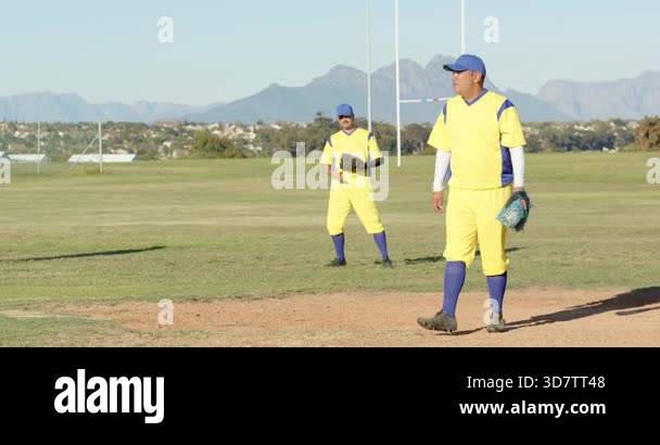 Tired male pitcher walking off mound with glove, sinking down as ...