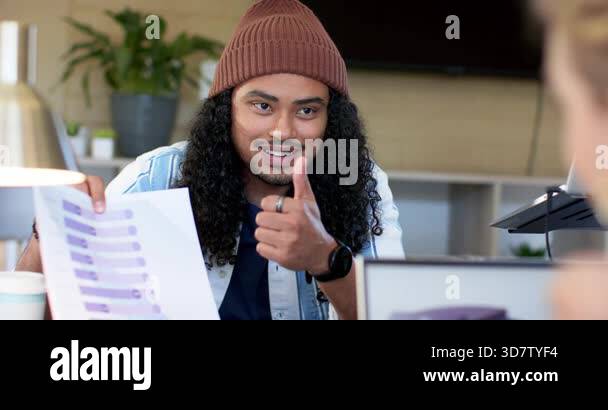 Holding printed bar chart report, Asian man explaining data to ...