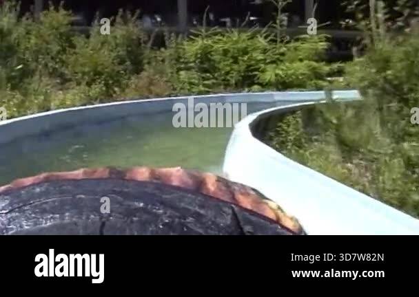 Camcorder footage shows a point-of-view ride on a log flume at an ...
