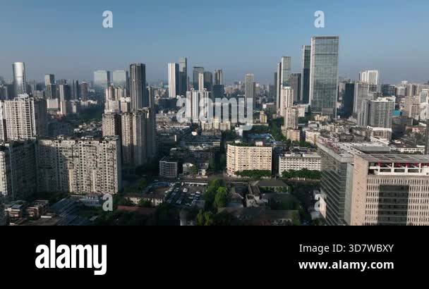 Aerial view looking down a straight city road lined symmetrically by ...
