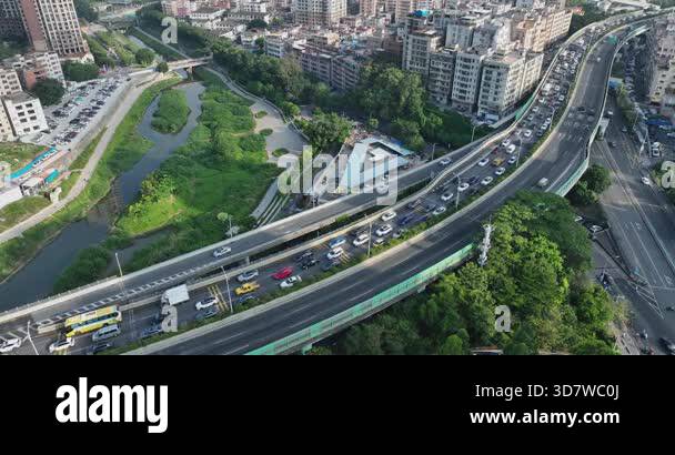 massive highway interchange encircled by dense skyscrapers. Chinese ...
