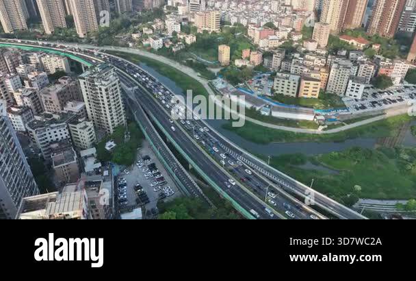 massive highway interchange encircled by dense skyscrapers. Chinese ...