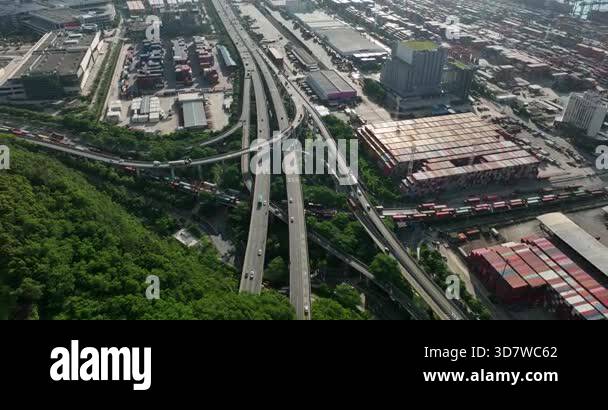 massive highway interchange encircled by dense skyscrapers. Chinese ...