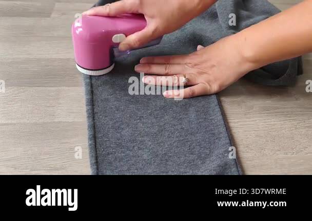 Modern fabric shaver to remove lint and pills . High quality 4k footage ...