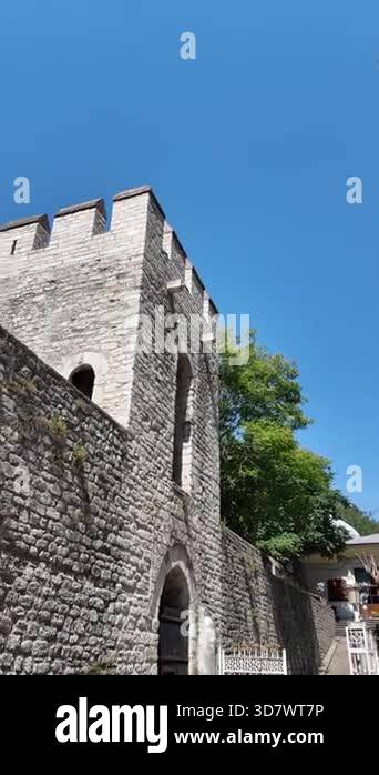 Discover a grand stone castle with a bright blue sky overhead Stock ...
