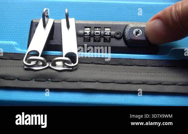 Closeup of person hand choking lock with a security code on personal ...