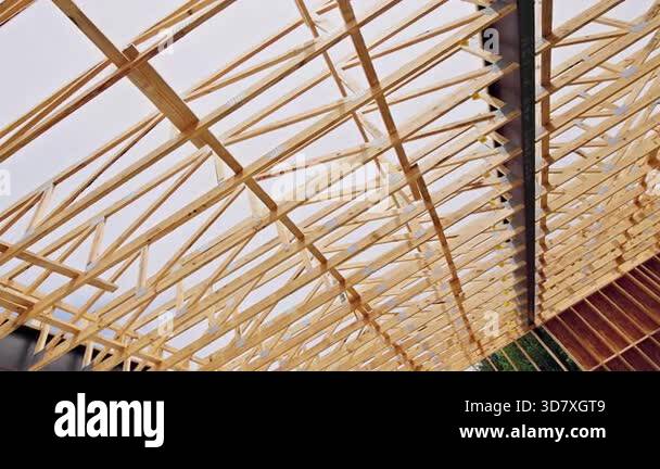 Detailed view of wooden beams forming structure of roof rafters beams ...
