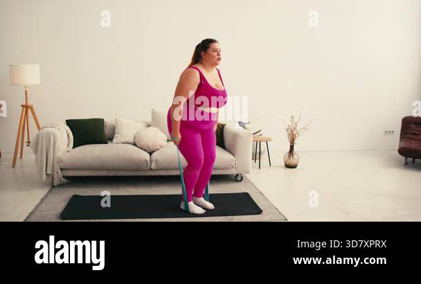 Overweight Plus Size Woman does strength training exercise using ...