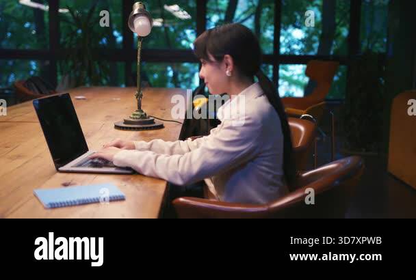 Happy, Hispanic Business Woman Working on Laptop Computer with Motivation, Success at Office ...