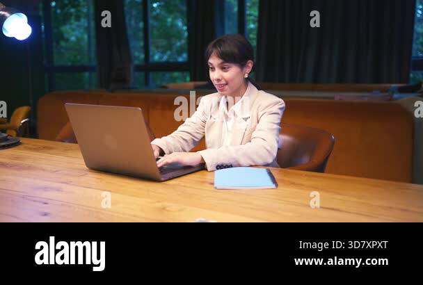 Happy, Hispanic Business Woman Working on Laptop Computer with Motivation, Success at Office ...