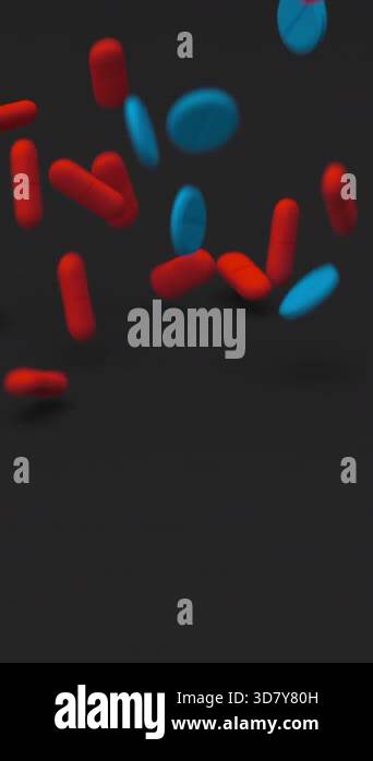 Blue and red tablets falling on black background in slow motion. Drugs ...