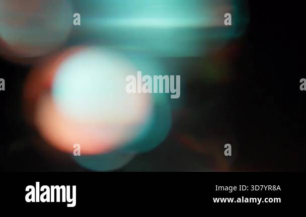 Orange And Teal Color Light Flashing Leaks On Black Bokeh Stock Video ...