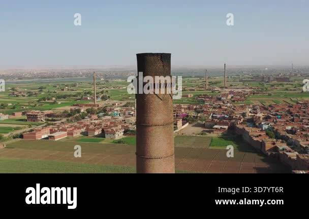 Aerial view of a large old chimney or pipe in the city showcasing an ...