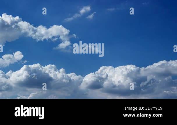 Time-lapse of White clouds sweeping across the sky, revealing the calm ...