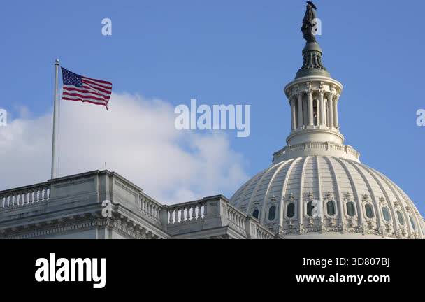 Capitol dome with waving US flag. Washington DC government building ...