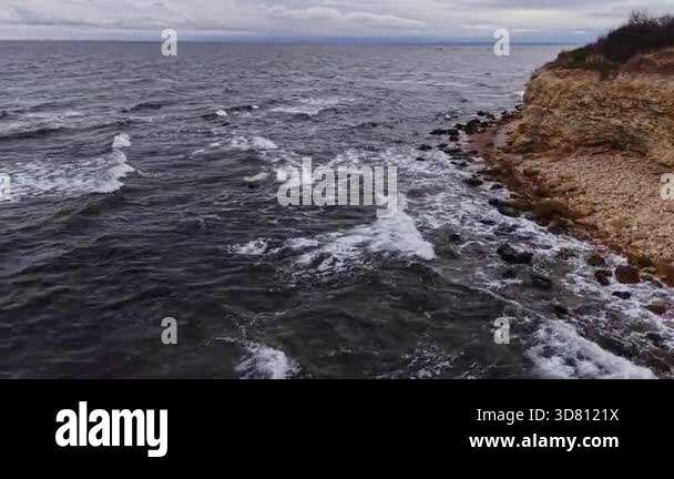 This aerial shot showcases the rugged coastline of Bulgaria, featuring ...