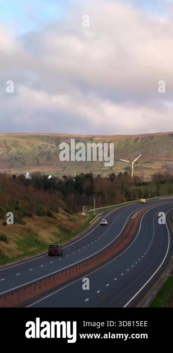 Vertical View of a Multi-Lane Highway Curving Through Hilly Terrain ...
