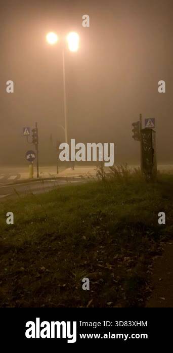 traffic lights at the road in fog at night Stock Video Footage - Alamy
