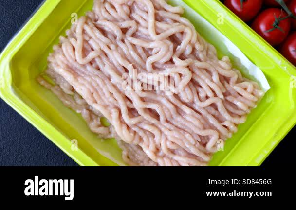 Raw ground chicken for burgers and other food. Raw minced chicken meat ...