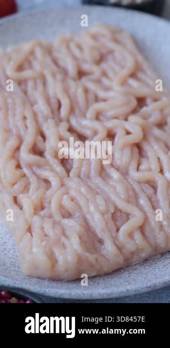 Raw ground chicken for burgers and other food. Raw minced chicken meat ...