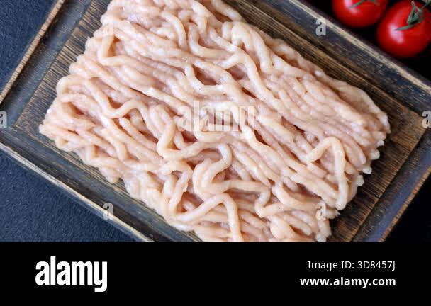 Raw ground chicken for burgers and other food. Raw minced chicken meat ...