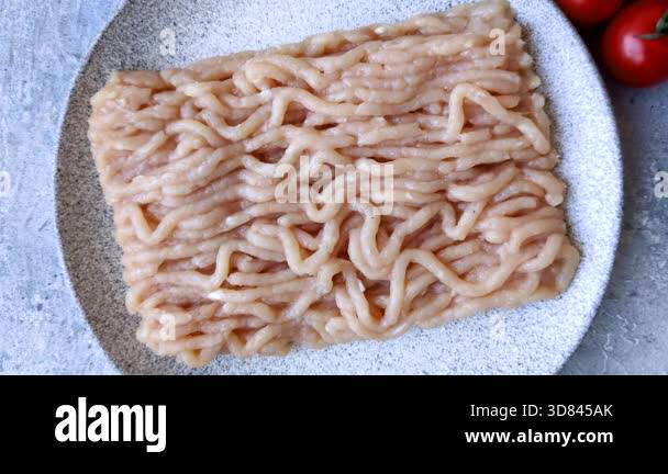 Raw ground chicken for burgers and other food. Raw minced chicken meat ...