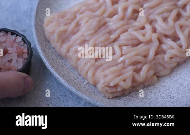 Raw ground chicken for burgers and other food. Raw minced chicken meat ...