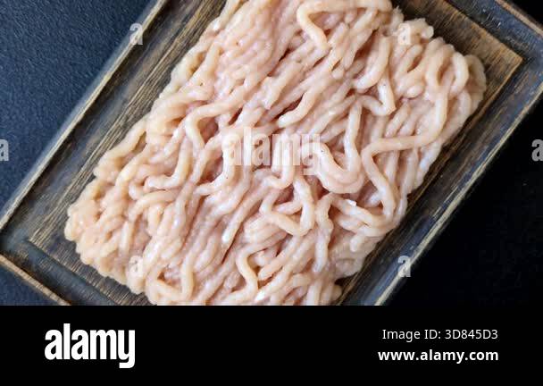 Raw ground chicken for burgers and other food. Raw minced chicken meat ...
