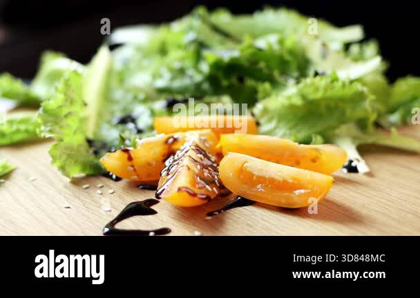 A young beautiful woman of European appearance washes her hair with ...