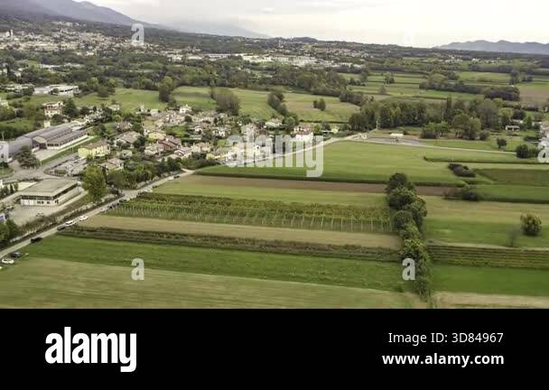 Panoramic aerial view of a picturesque italian valley featuring a small ...