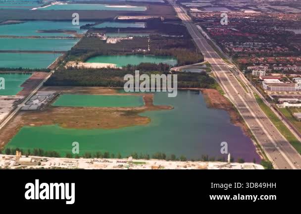 Beautiful aerial view from airplane window of Miami highways, lakes and ...