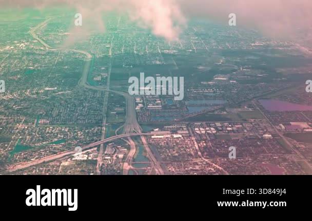 Beautiful aerial view from airplane window of Miami city grid with ...