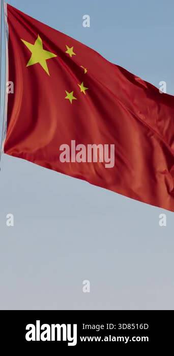 China, Beijing: Cinematic Vertical Waving National Flag Against Blue ...