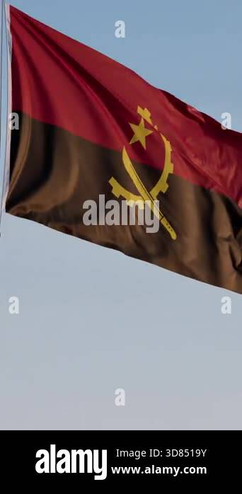 Angola, Luanda: Cinematic Vertical Waving National Flag Against Blue ...