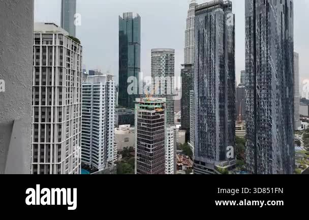 time lapse shot of a large, dense metropolitan city dominated by a mix ...
